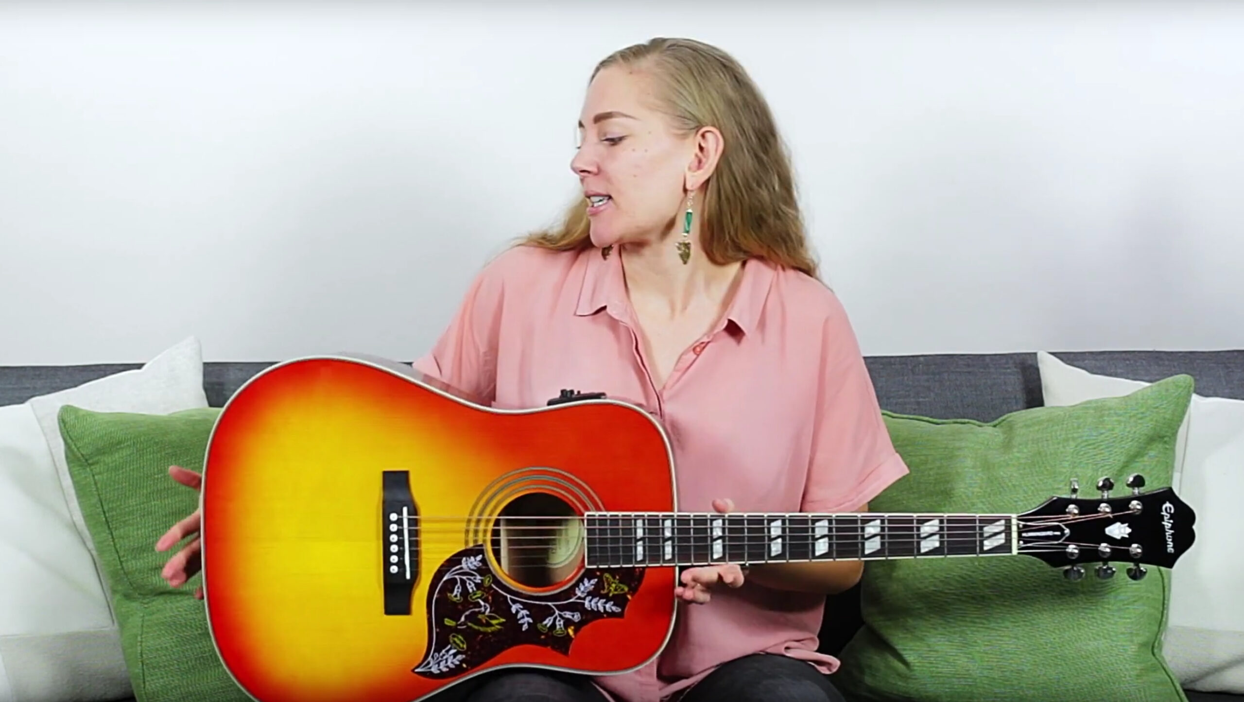 How to hold a guitar properly: sitting and standing tips | Yousician